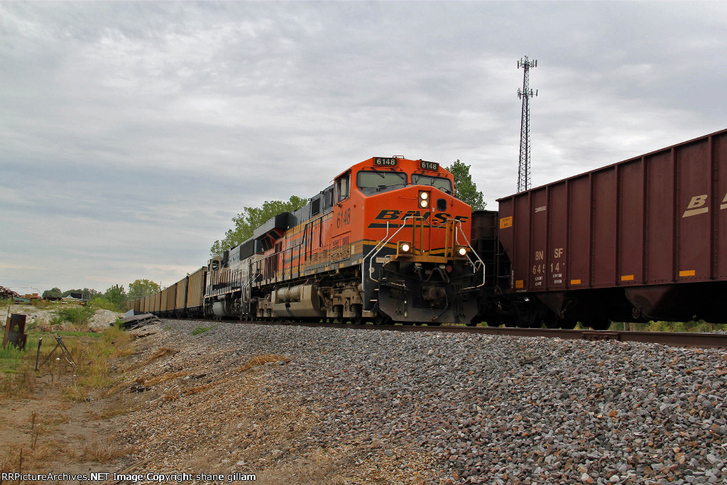 BNSF 6148 leads a empty ucex coal NB.
